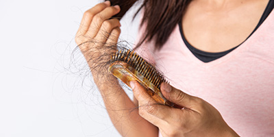 Hair loss in women: What causes it and how to stop it | Nebraska ...